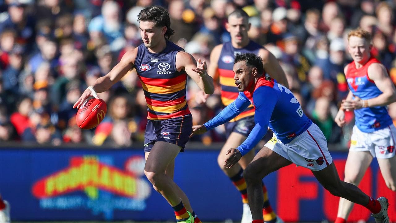 Crows claw their way back for thrilling win over Dees